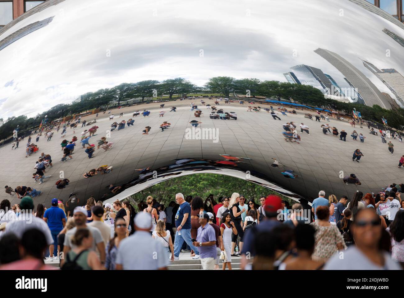 Visitors take photos of the "Cloud Gate" sculpture, also known as the ...