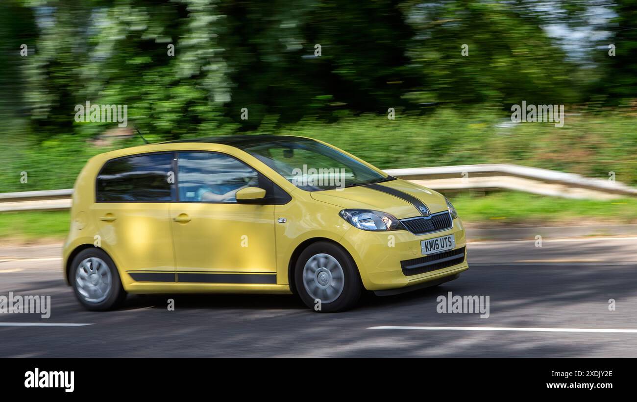 Milton Keynes,UK - June 22nd 2024: 2016 yellow Skoda Citigo car driving ...