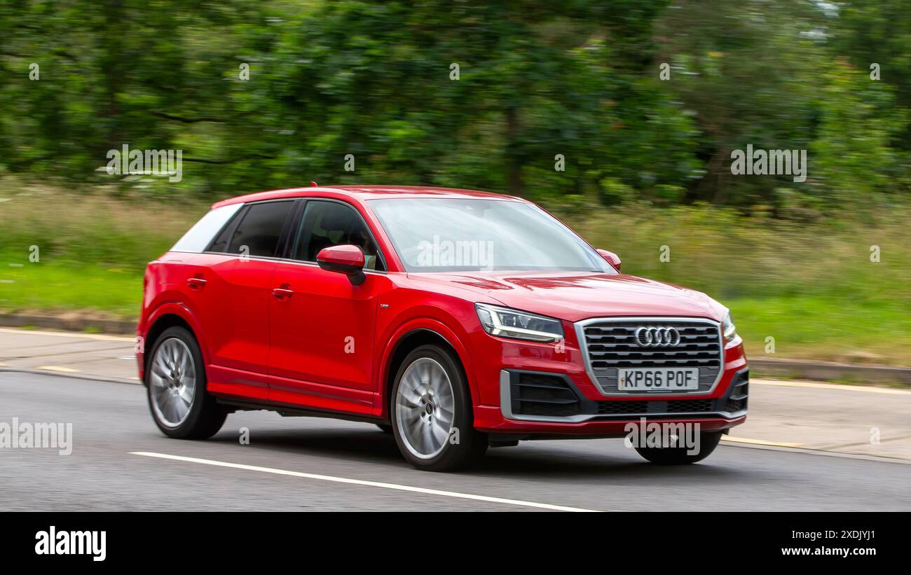 Milton Keynes,UK - June 23rd 2024: 2016 red Audi Q2 car driving on a ...