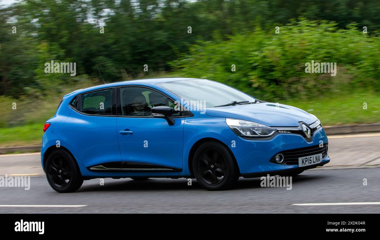 Milton Keynes,UK - June 21st 2024: 2015 blue Renault Clio car driving ...