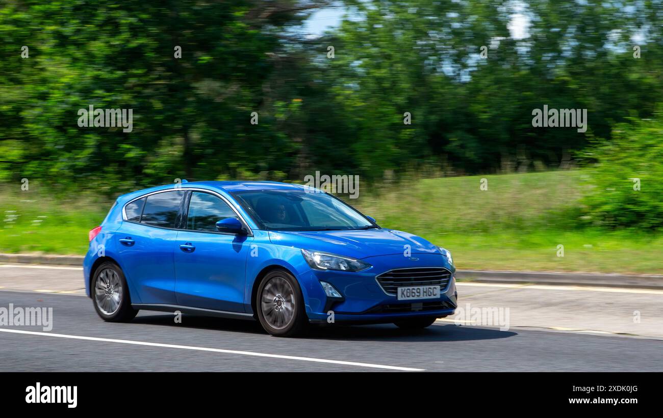 Milton Keynes,UK - June 21st 2024: 2020 blue Ford Focus car driving on ...