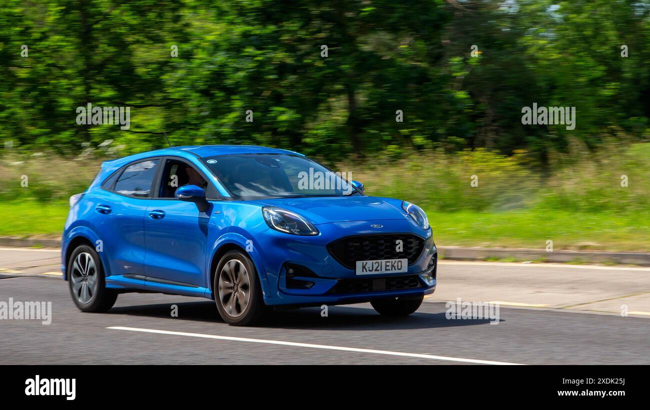 Milton Keynes,UK - June 21st 2024: 2021 blue Ford Puma car driving on a ...