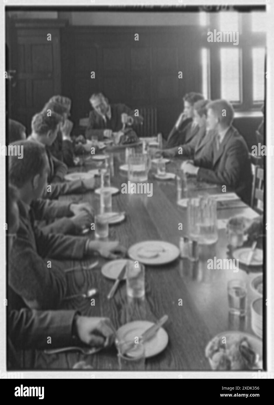 St. George's School, Newport, Rhode Island. Mr. Merrick carving roast ...