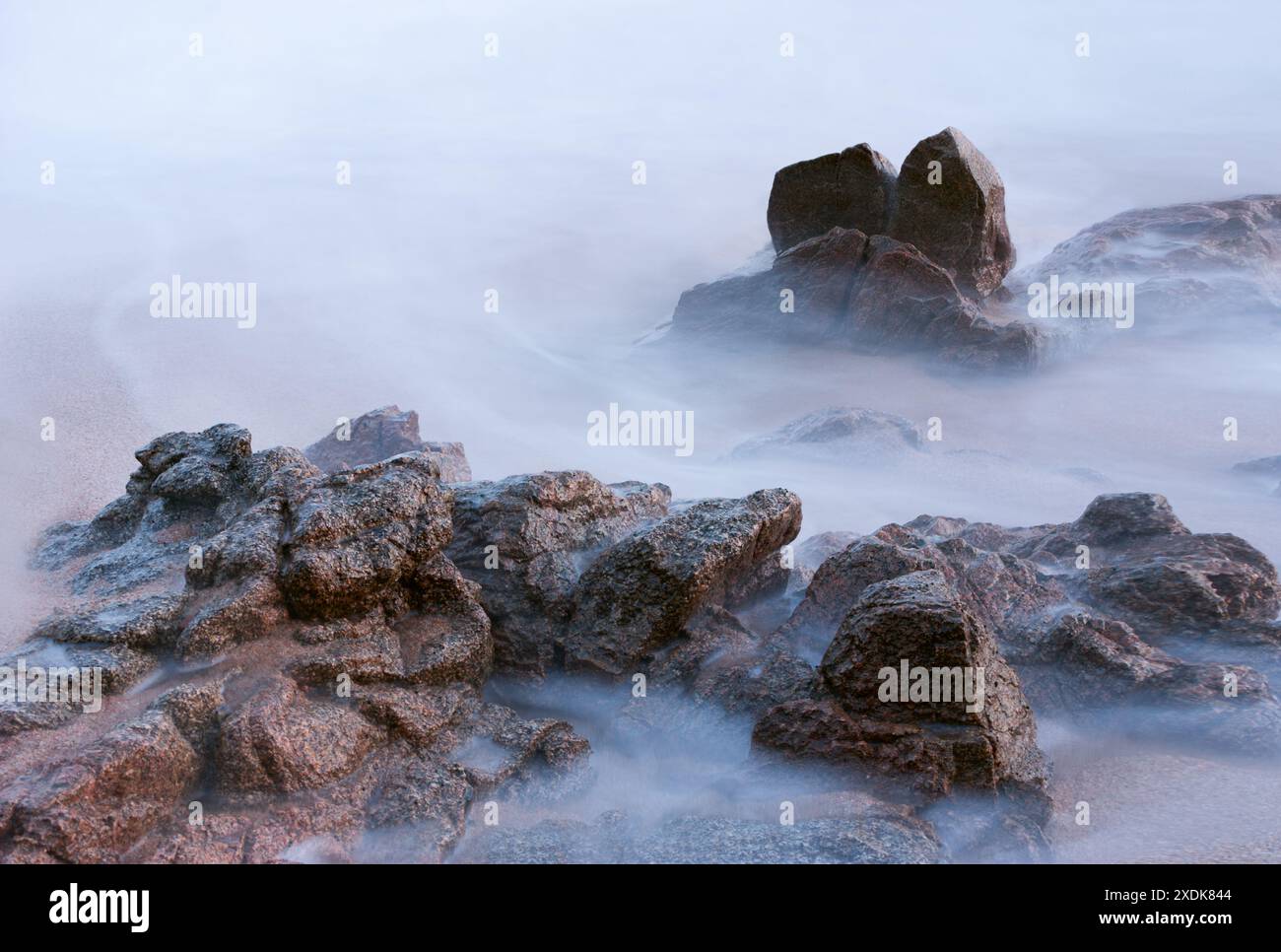 Detail of rocks in the sea with strange shapes, the water has a silk ...