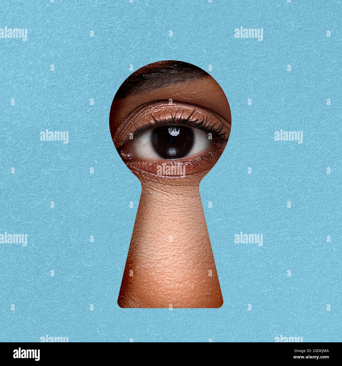 Woman looking through keyhole in light blue surface Stock Photo - Alamy