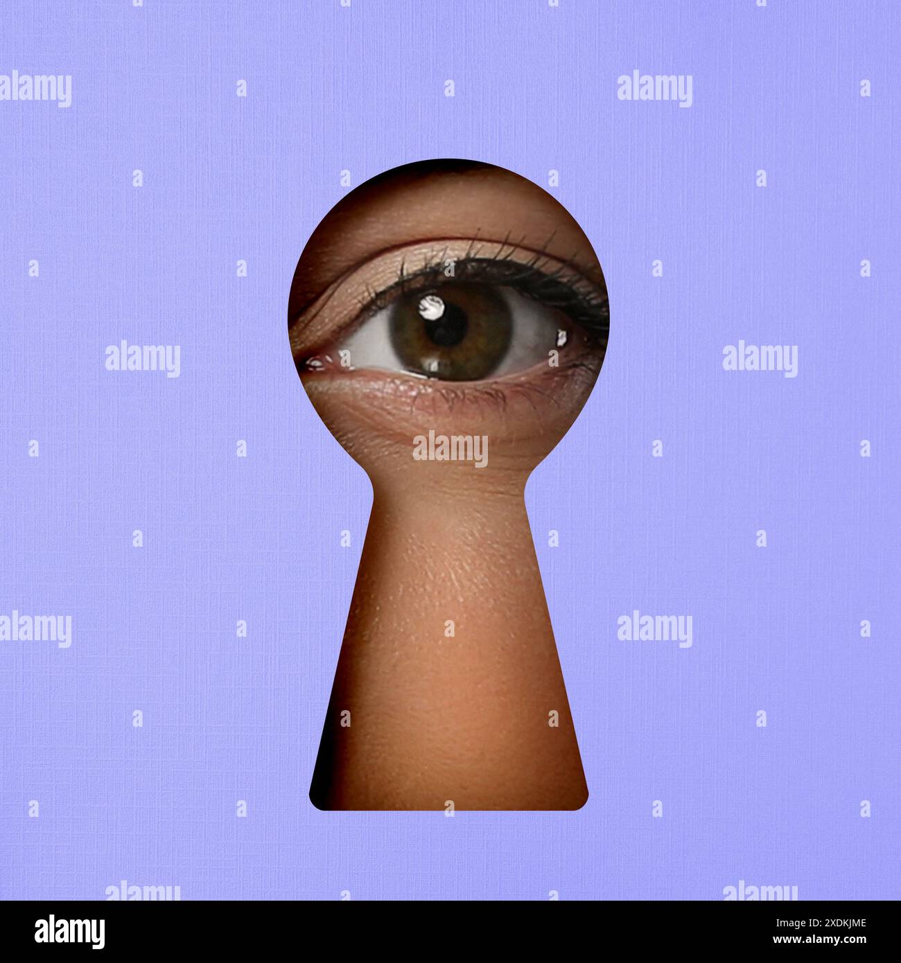 Woman looking through keyhole in blue surface Stock Photo - Alamy