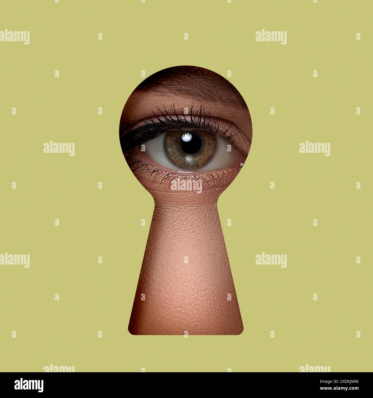 Woman looking through keyhole in light green surface Stock Photo - Alamy