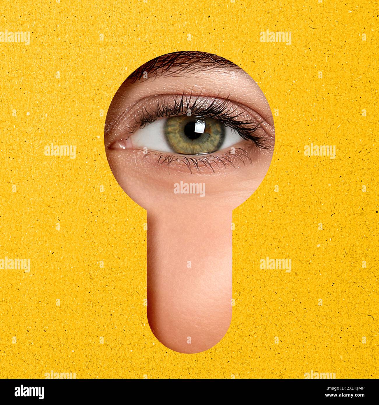 Woman looking through keyhole in yellow surface Stock Photo - Alamy