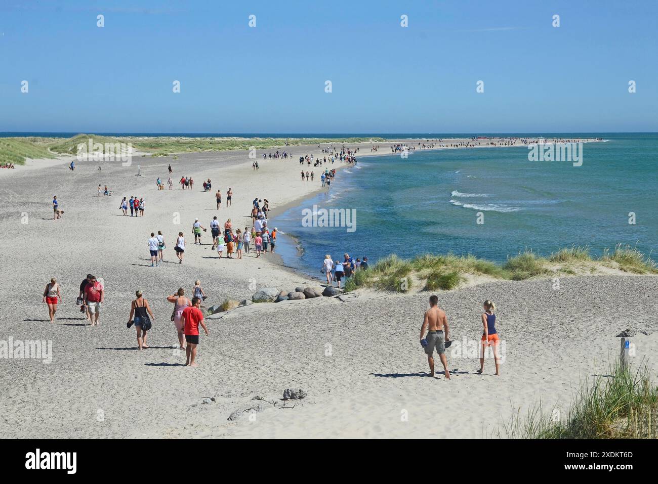 Ttourists walking at the northern tip of Denmark where the Baltic Sea ...