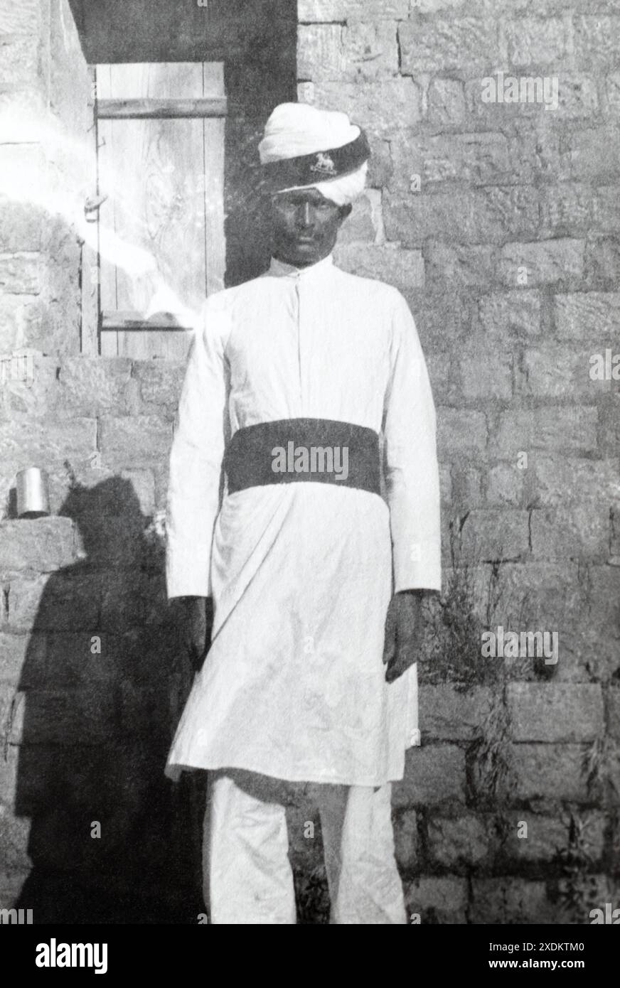 An Indian porter of the Queen's Royal Regiment (West Surrey) in India c ...