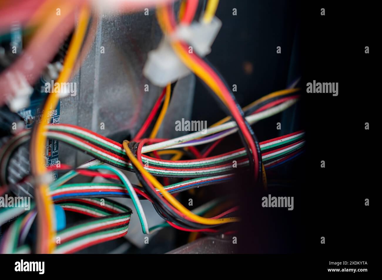 Close-up of colorful electrical wires inside a device, showing various ...