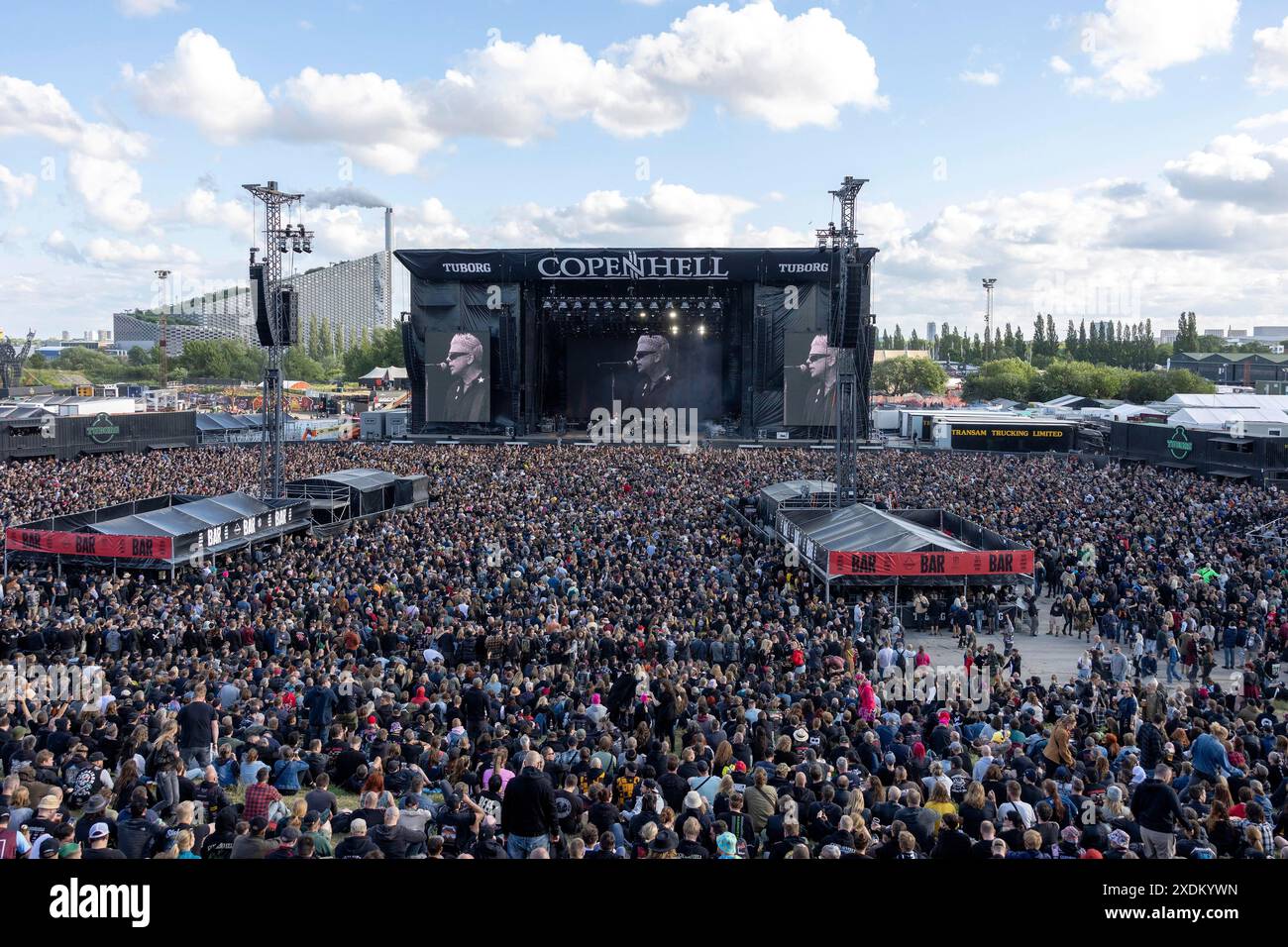 Copenhagen, Denmark - 19 Jun 2024: Festivalgoers listening to the band ...