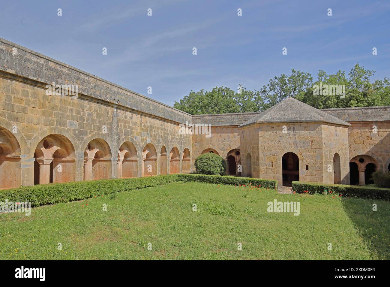 Well house with cloister and courtyard of the Romanesque abbey of Le ...