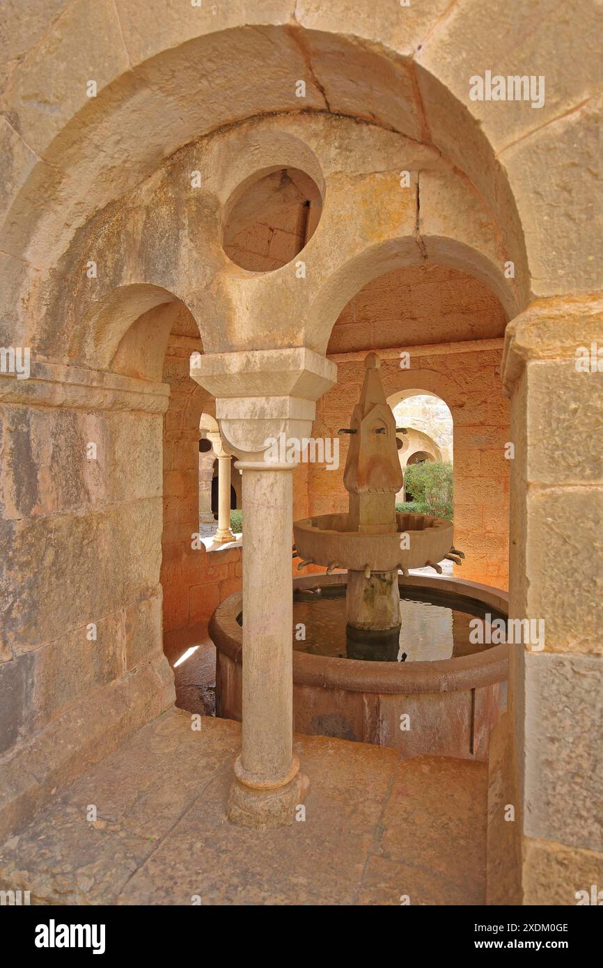 View through the window of the well house of the Romanesque abbey Le ...