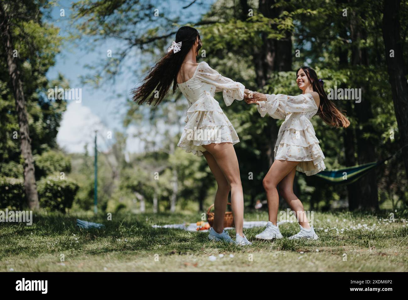 Beautiful laughing young woman twirling hi-res stock photography and ...