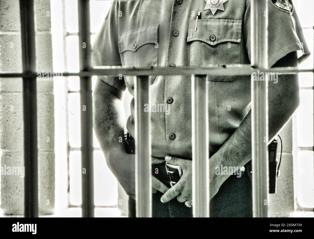 Law Enforcement Officer Looking into Jail Cell, WY, USA 1997 Stock ...