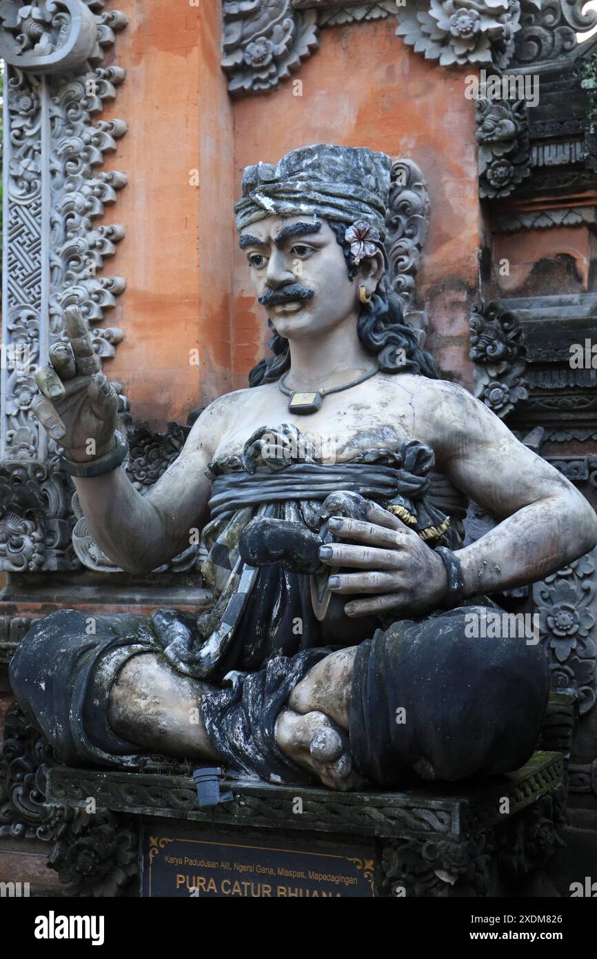Stone statue of a Hindu god at Pura Tirta Empul, the Balinese Holy ...