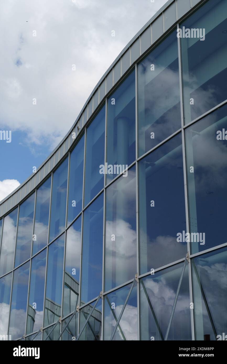 Stadium with Glass Windows and Clouds Stock Photo - Alamy