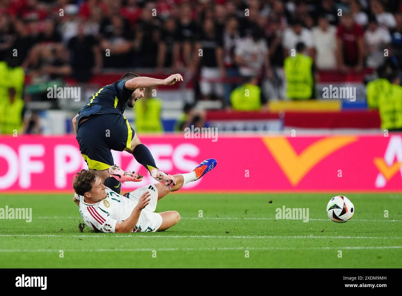 Hungary's Callum Styles (left) fouls Scotland's John McGinn and is ...