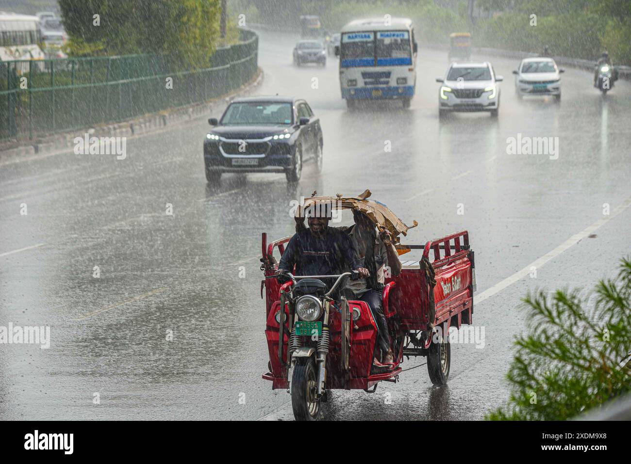 GURURAM, INDIA - JUNE 23: People enjoying the rain at sector-11 ...