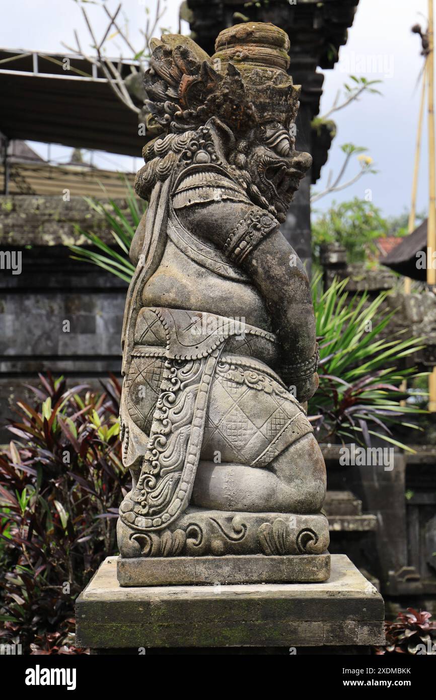 Stone statue of a Hindu god at Pura Besakih mother temple in Bali ...
