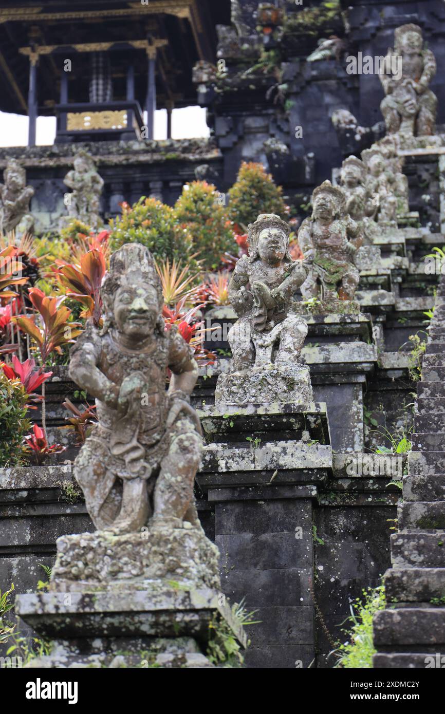 Stone statues of a Hindu god at Pura Besakih mother temple in Bali ...
