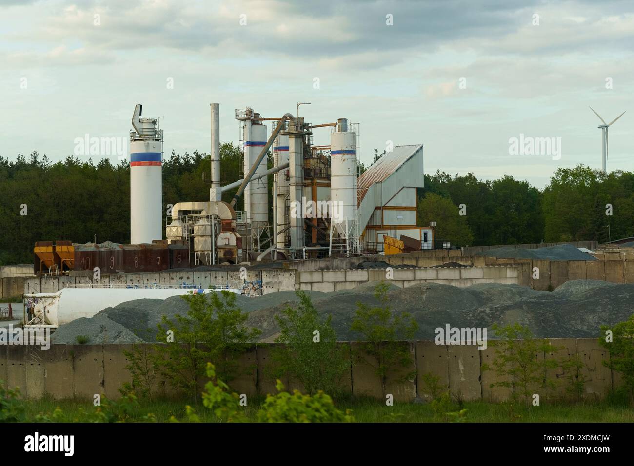 A factory with massive cement production in progress. Machinery ...