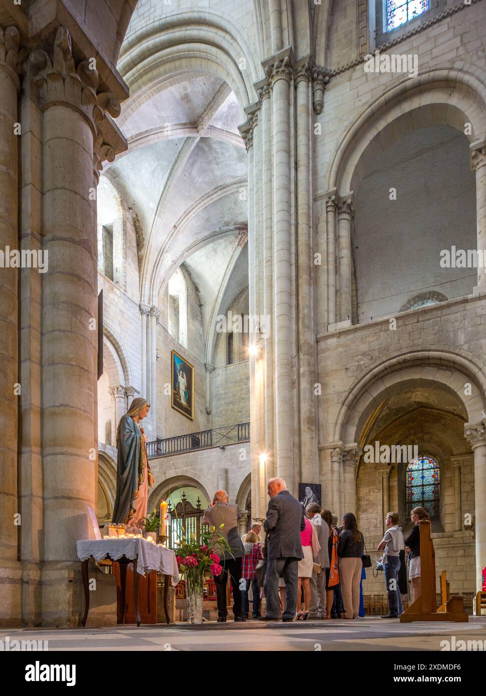 A group of people inside the historic Men's Abbey Church of Saint ...