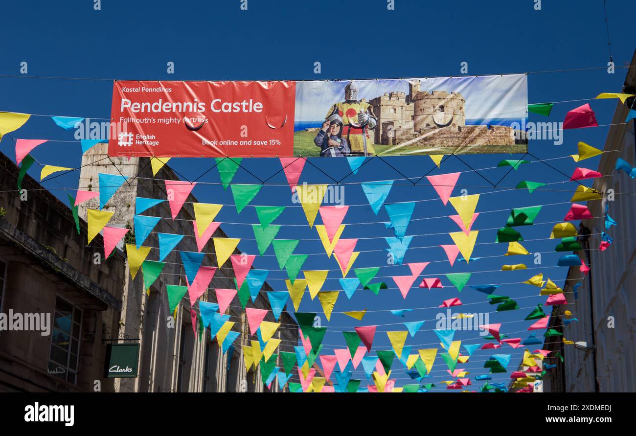 Colorful bunting flags strung across a street in Falmouth Cornwall with ...
