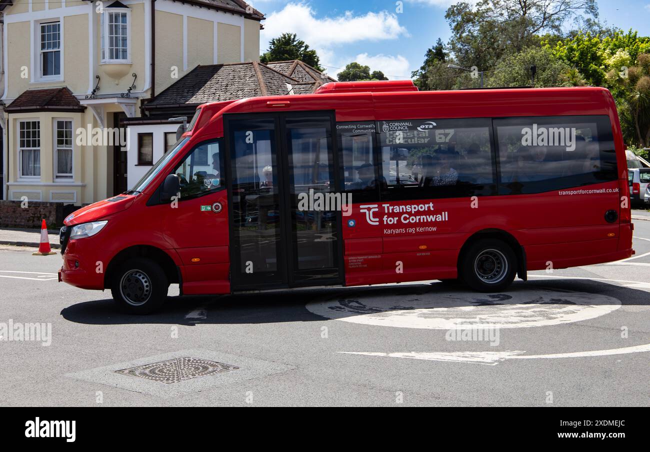 Red public transport minibus in Cornwall labeled 'Transport for ...