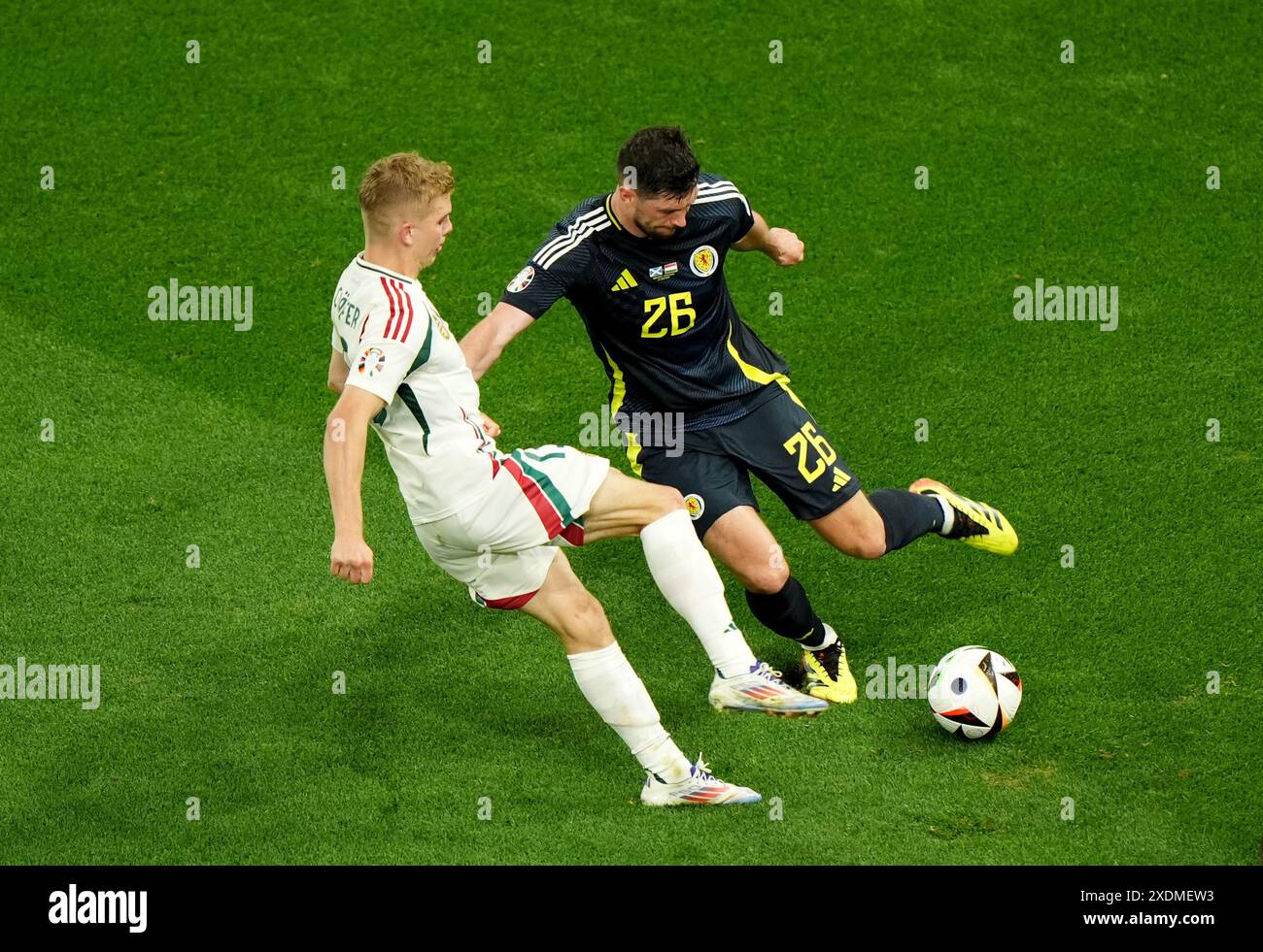 Hungary's Andras Schafer (left) and Scotland's Scott McKenna battle for ...