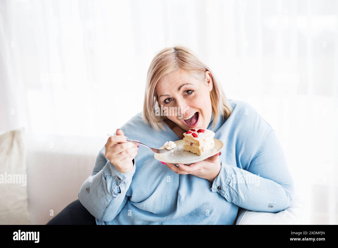 Fat woman eating slice cake hi-res stock photography and images - Alamy