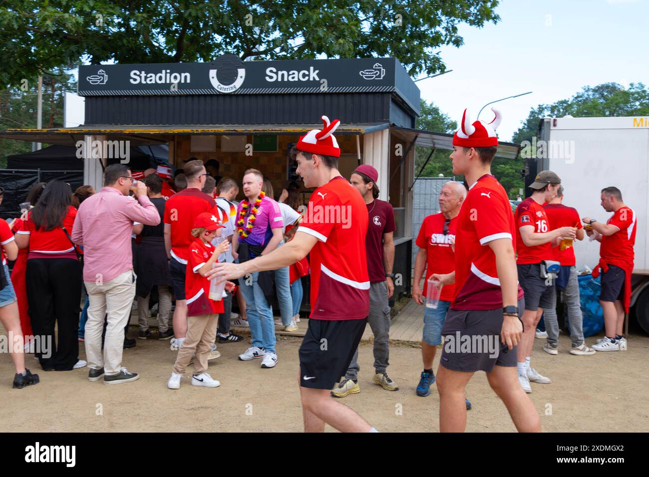 Football fans, spectators, supporters in colorful Germany and ...