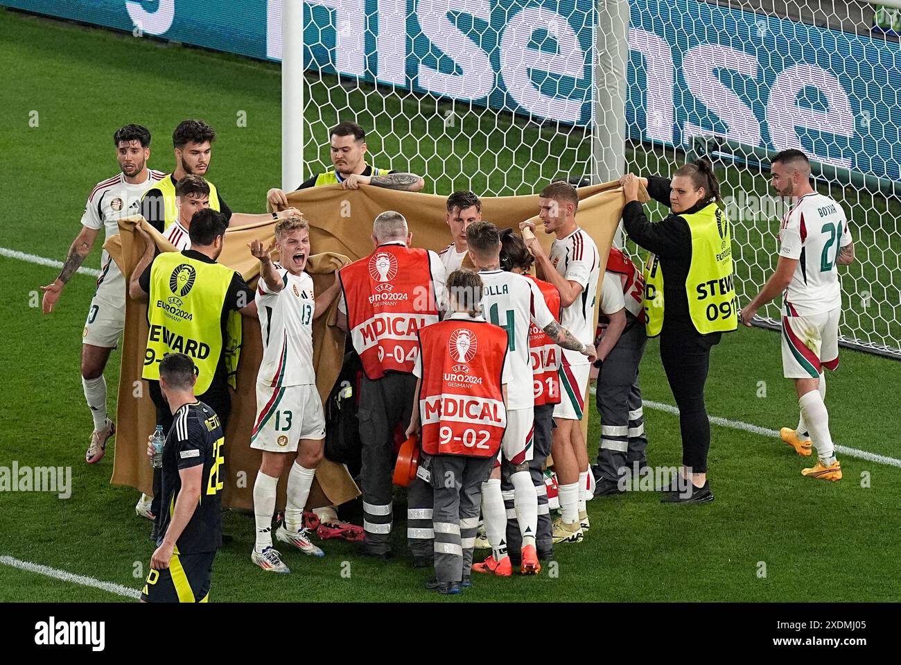 Hungary players and staff cover Barnabas Varga after an injury during a ...