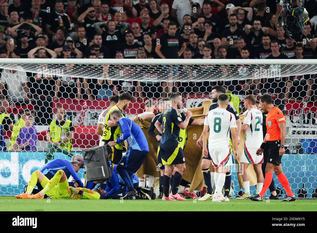 Players receive medical attention following a collision between ...