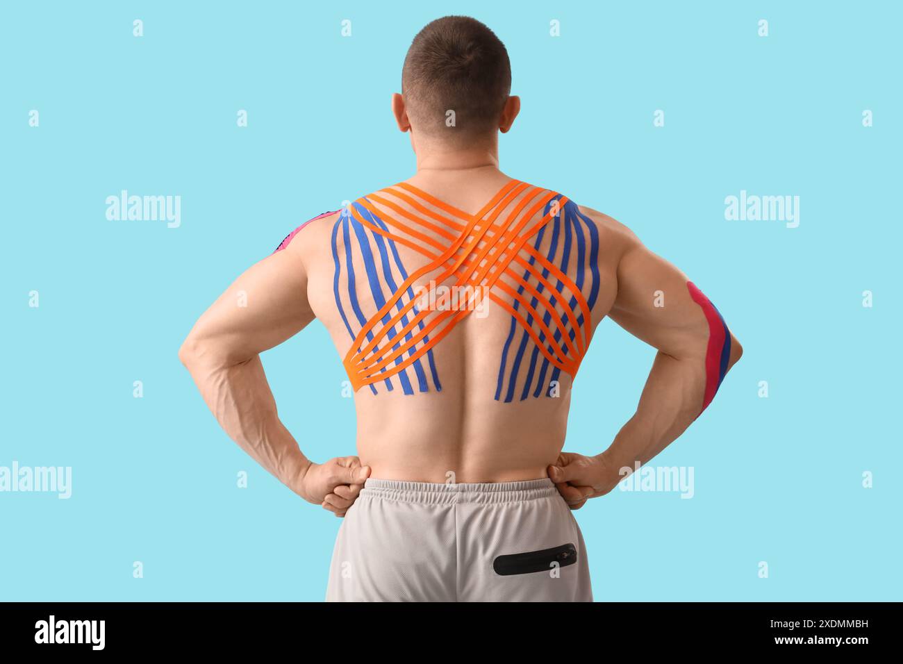 Handsome muscular bodybuilder applying hi-res stock photography and ...