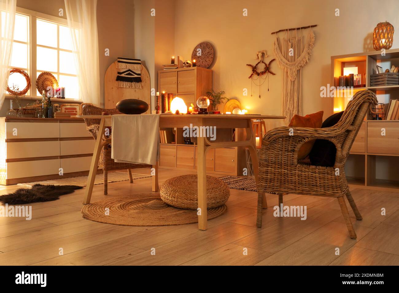 Interior of witch's room with magic attributes, table and burning ...