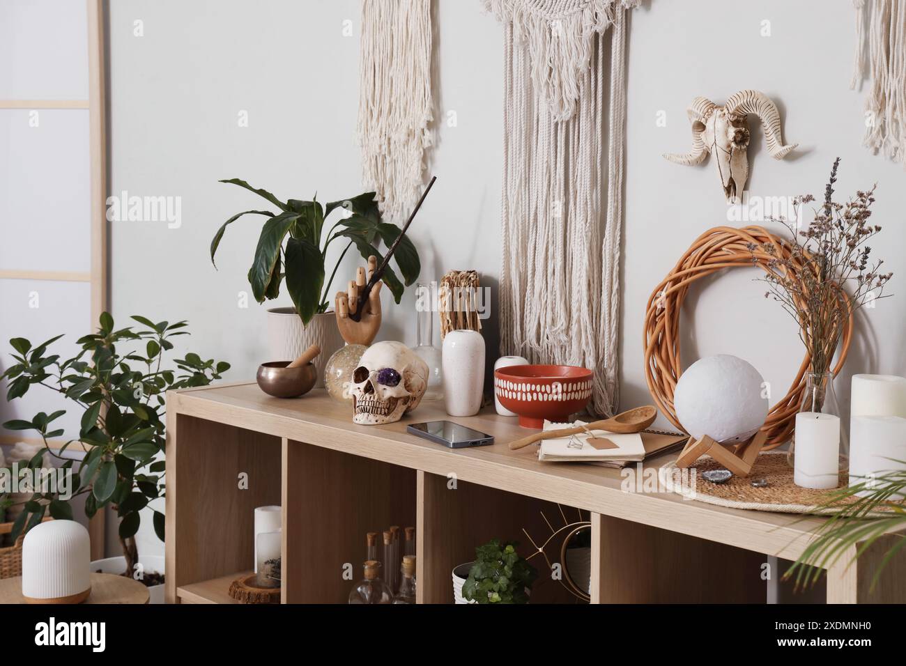 Magic attributes on shelf in witch's room Stock Photo - Alamy