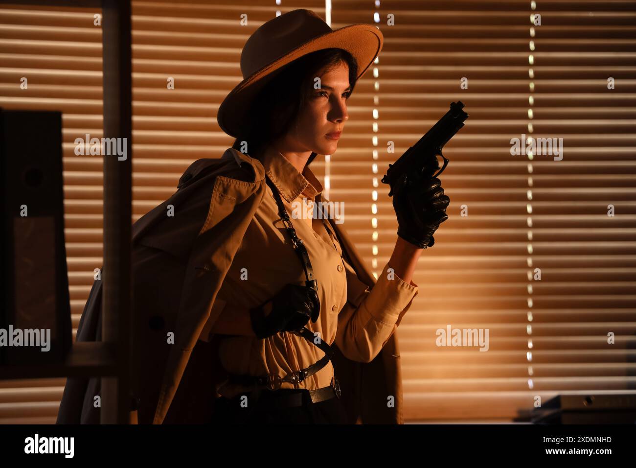 Female spy gun hi-res stock photography and images - Alamy