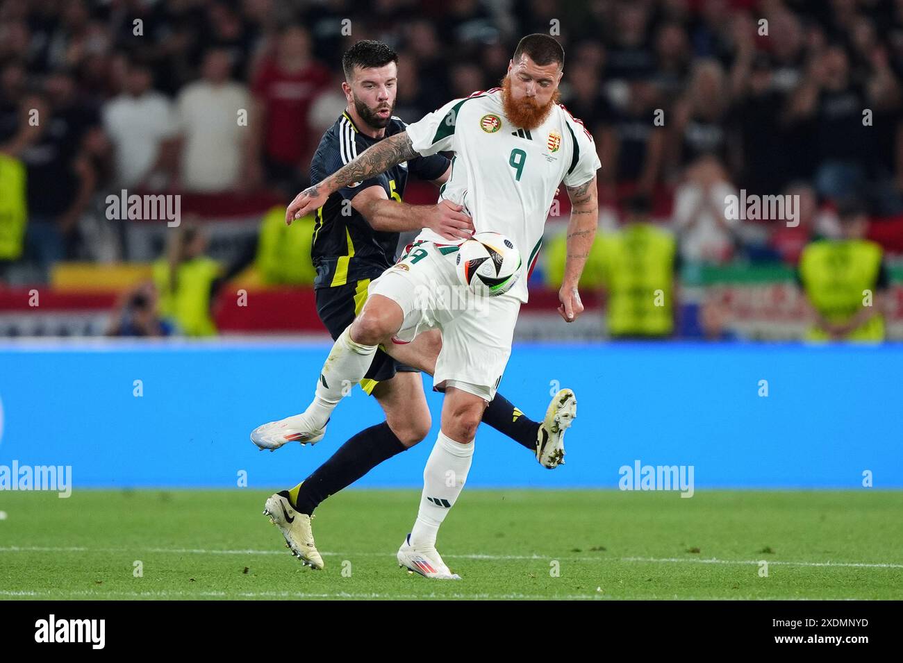 Scotland's Grant Hanley (left) and Hungary's Martin Adam battle for the ...