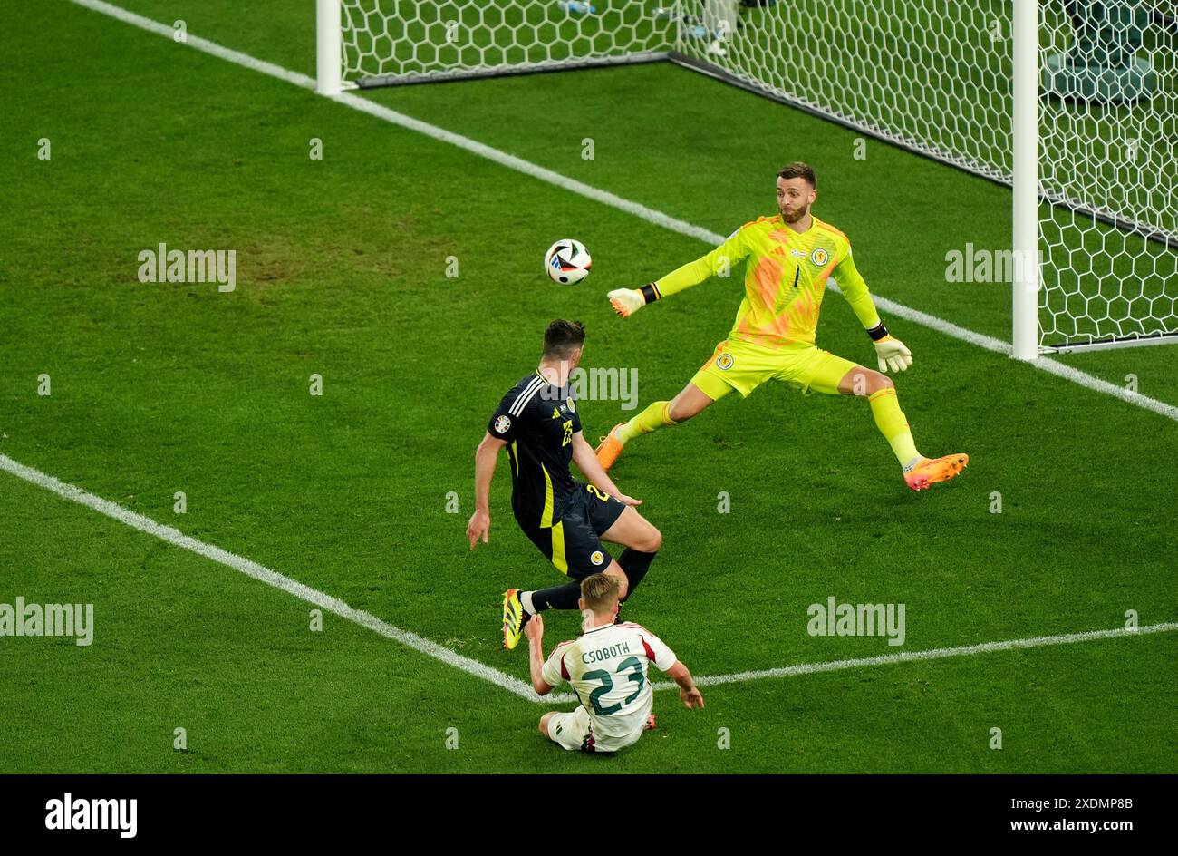 Hungary's Kevin Csoboth (bottom) hits the post with his shot during the ...