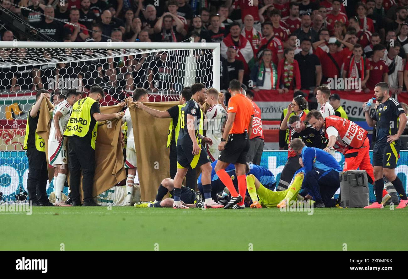 Hungary's Barnabas Varga receives treatment following a collision ...
