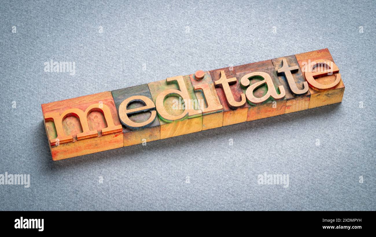meditate word, text in retro letterpress wood type stained by color ...