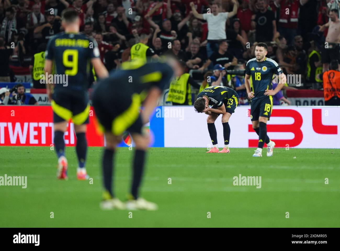 Scotland's Jack Hendry and team-mates react after Hungary's Kevin ...