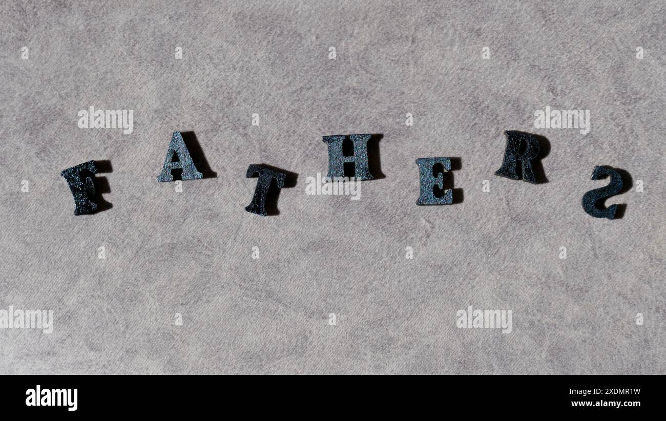 Lettering father in black letters on grey background on father's day ...