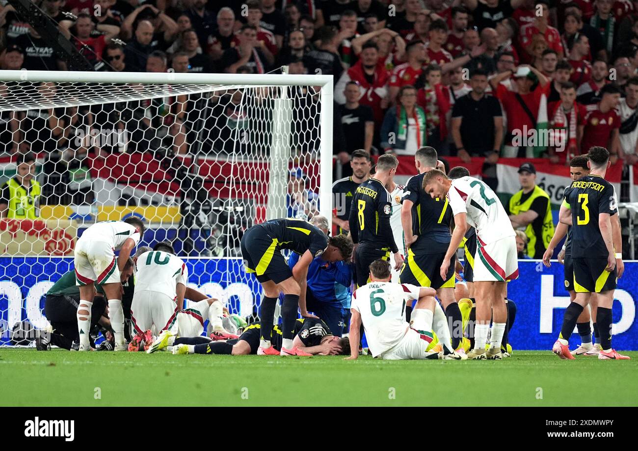 The aftermath of a collision between Scotland goalkeeper Angus Gunn and ...