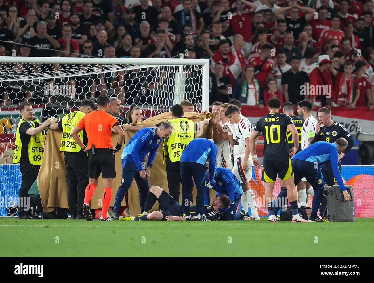 Hungary's Barnabas Varga receives treatment following a collision ...