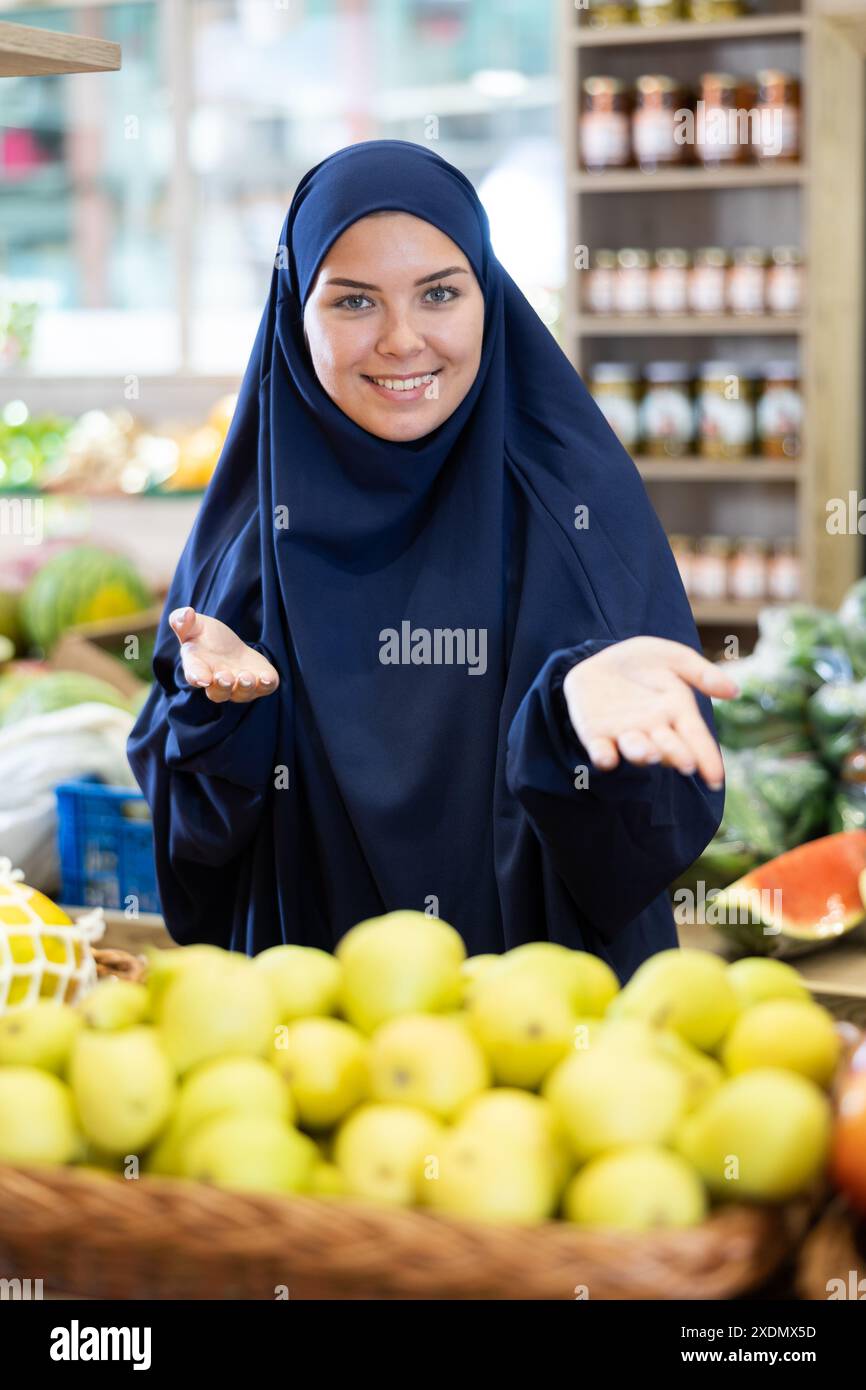 Portrait of a positive contented woman in a veil in supermarket Stock ...