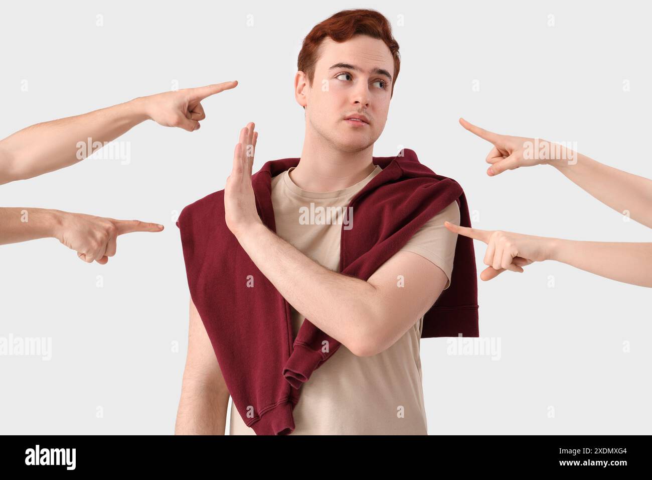 People pointing at young man on white background. Accusation concept ...