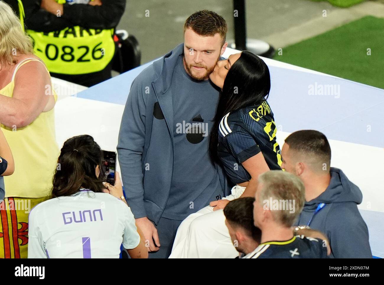 Scotland goalkeeper Zander Clark is kissed by his wife Robyn Clark ...